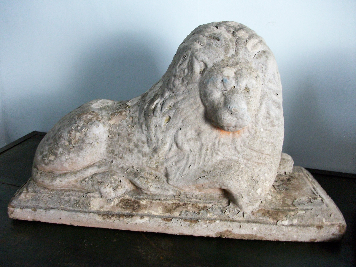 A pair of cast stone lions