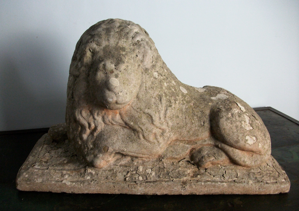 A pair of cast stone lions