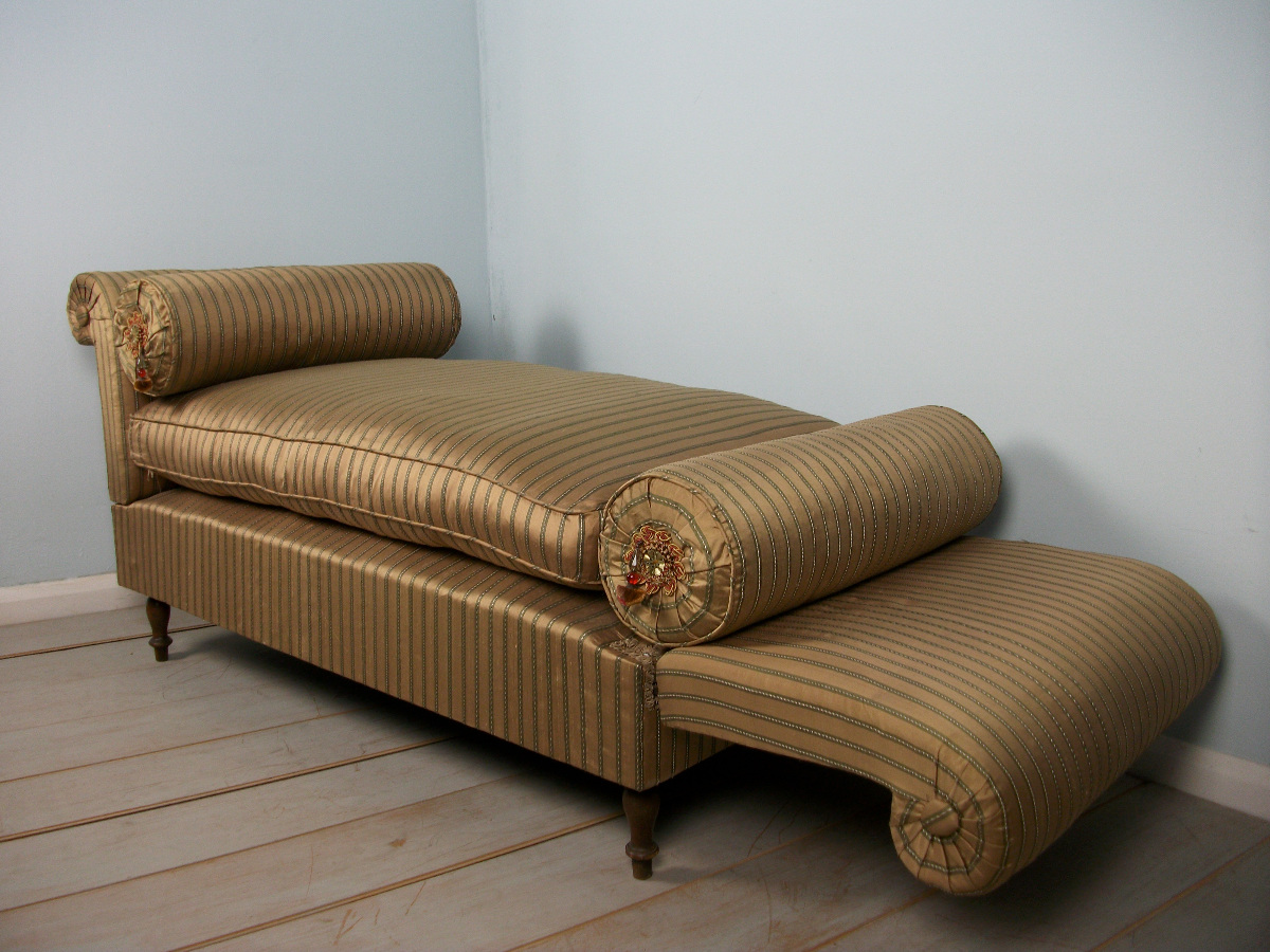 A very decorative window seat settee